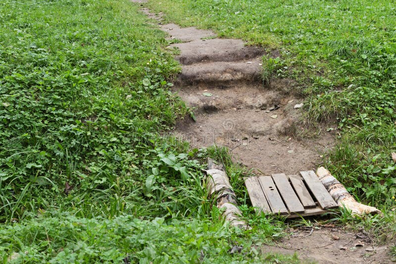 Small Bridge from the Boards through the Drainage Groove Stock Image ...
