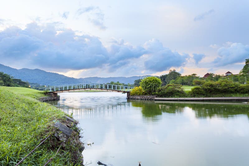 Small Bridge in Golf Course Green Grass Field and Lagoon. Stock Photo ...