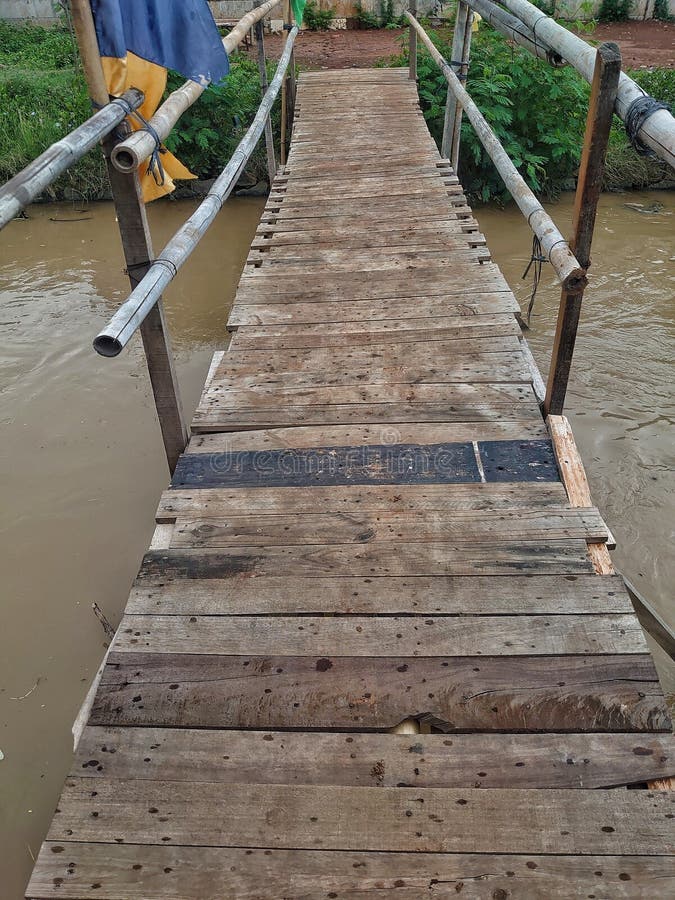 A Small Bridge Made of Wood and Bamboo is a Connecting Tool between ...