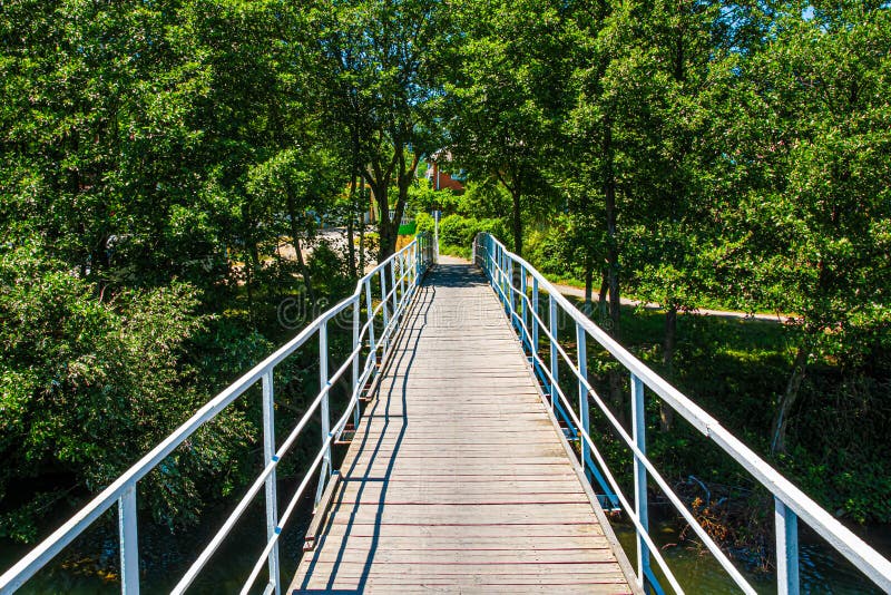 Small Bridge with a Metal Railing Over a Mountain River Stock Photo ...
