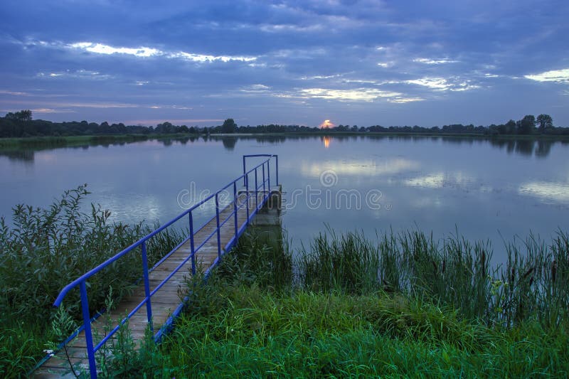 Small bridge over the lake stock image. Image of water - 124855193