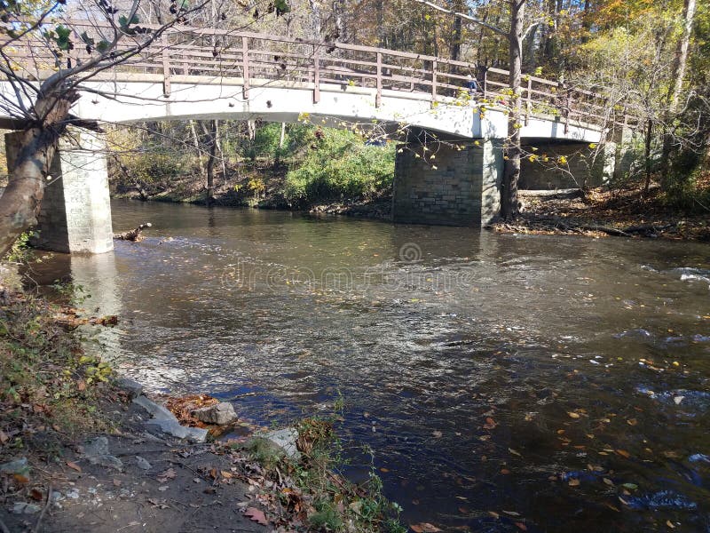 Small Bridge Over a River or Creek and Leaves Stock Photo - Image of ...