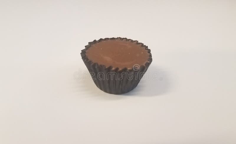 Small Brown Chocolate Candy in Wrapper on White Surface Stock Image ...