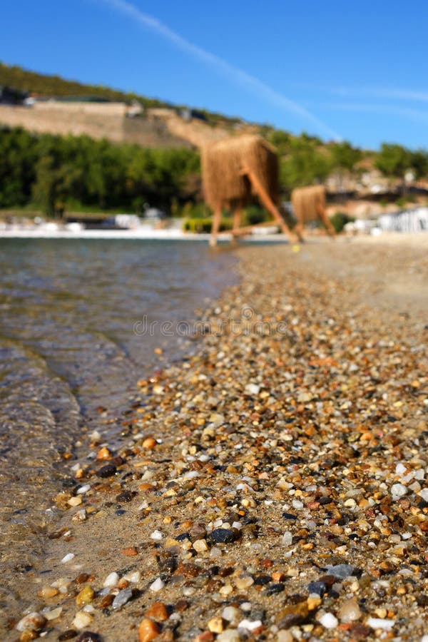 Small Brown Stones are Washed by Sea Water on the Shore. Pebble Beach ...
