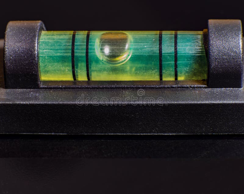 A Small Bubble Level on the Black Stock Image - Image of green, copy ...