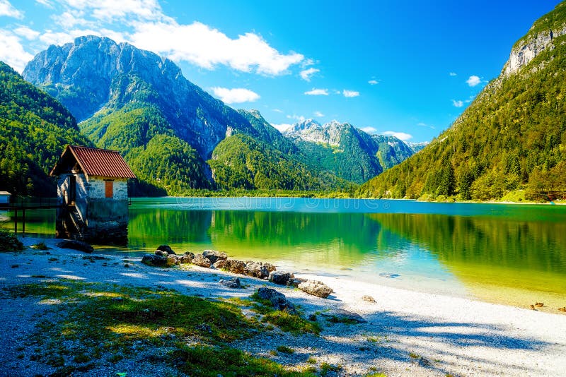 Small Building at a Beautiful Lake Surrounded by Stunning Mountain ...