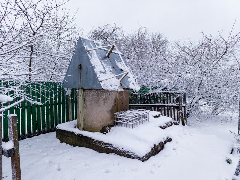 A Small Building in the Middle of a Snow Covered Yard Stock Image ...