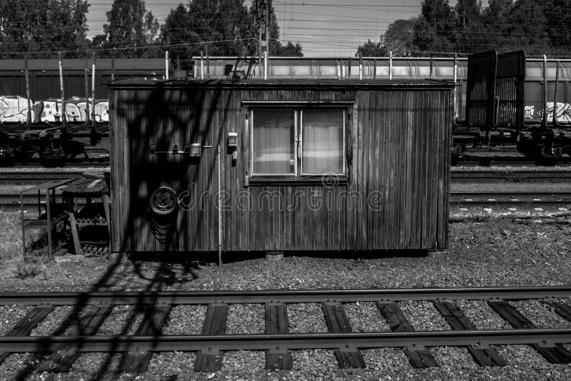 A Small Building by Railroad Tracks Stock Photo - Image of railroad ...