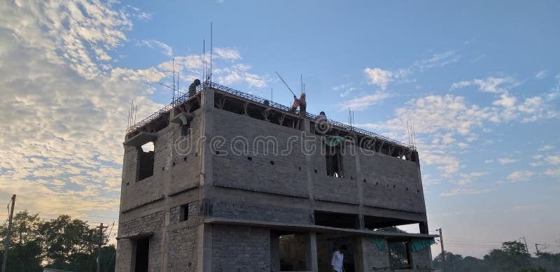 A Small Building Is Under Construction, Workers Are Working. Editorial ...