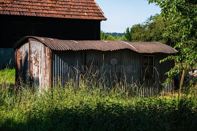 Small Buildings Next To Each Other Surrounded by Trees and Grass Stock ...