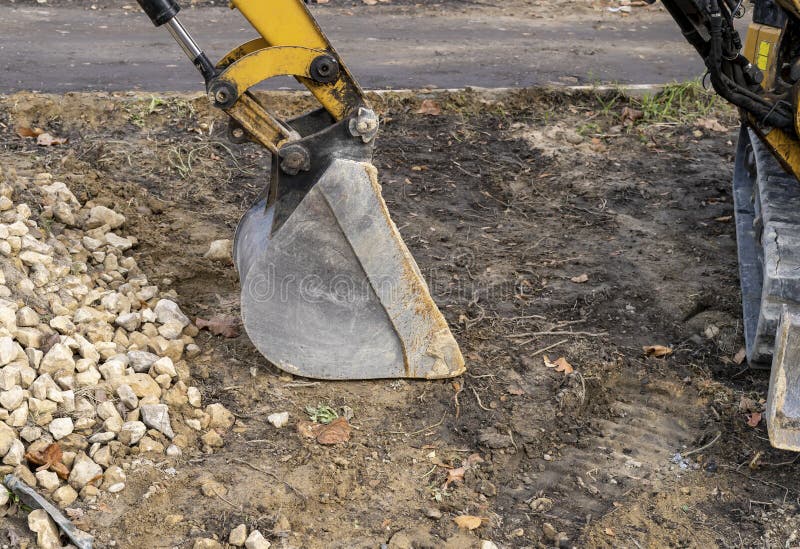 Small Bulldozer at Work. Orange Excavator on the Road. Construction ...