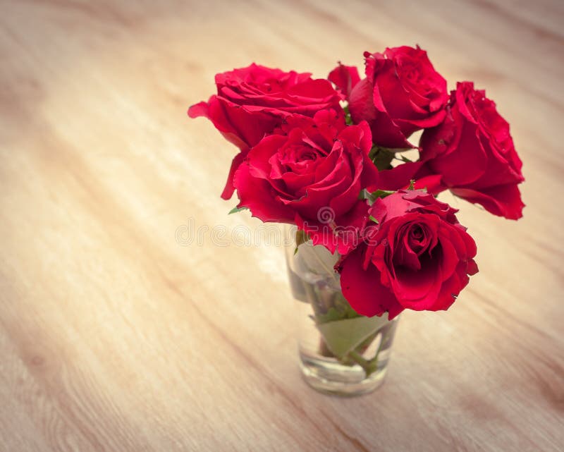 A small bunch of red roses stock photo. Image of retro - 39150474