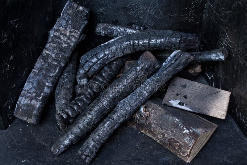 Small Burnt Logs on a Black Background Stock Image - Image of ...