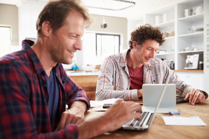 Small Business Partners Using Computers at Home Stock Image - Image of ...