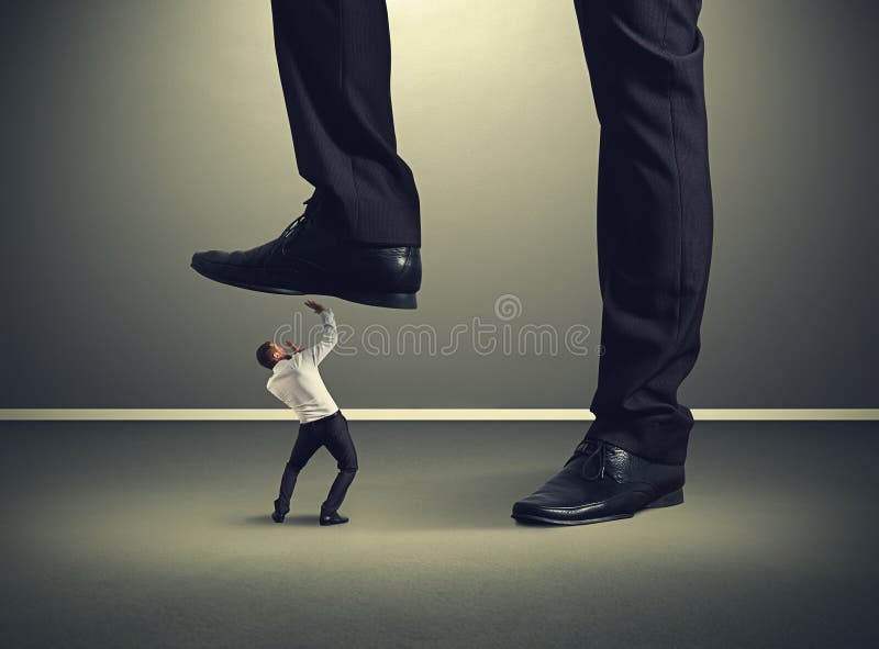 Small Businessman Under Big Leg Stock Image - Image of aggressive ...