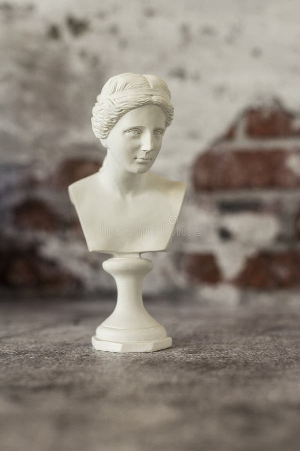 Small Bust of a Classical Greek Figure on a Gray Stock Image - Image of ...