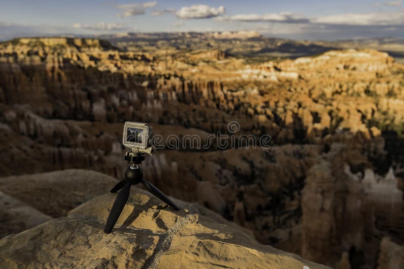 Small camera stand on rock stock photo. Image of attraction - 73095356