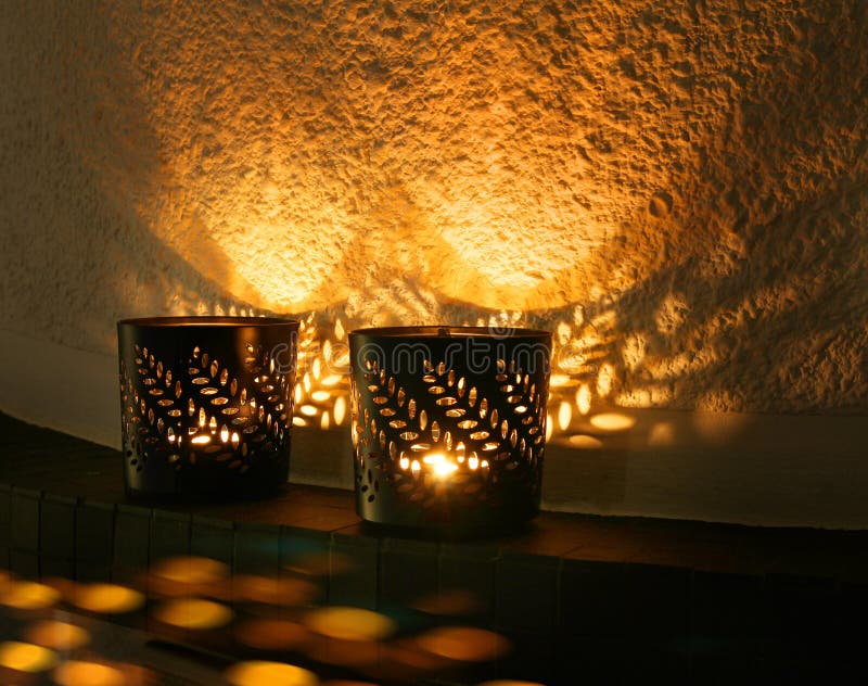 Small Candle Cups Reflecting Light Stock Photo - Image of small, fire ...