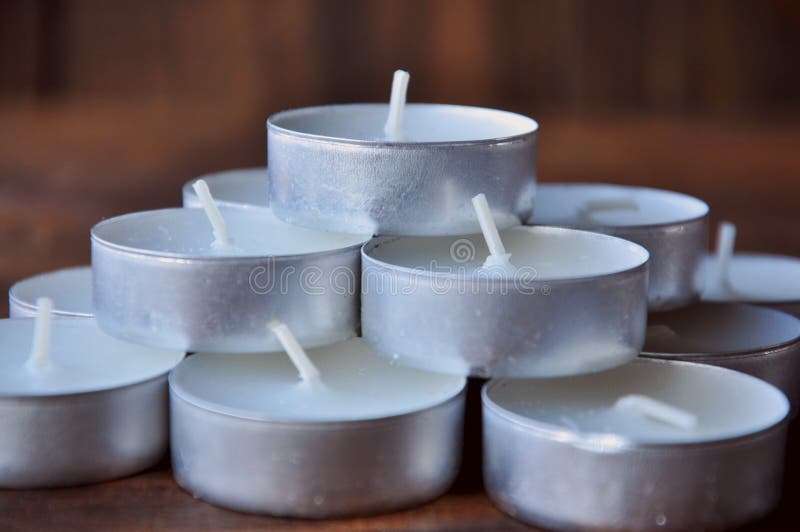 Small Candles - Pills are Stacked in a Pyramid on a Wooden Table. Stock ...