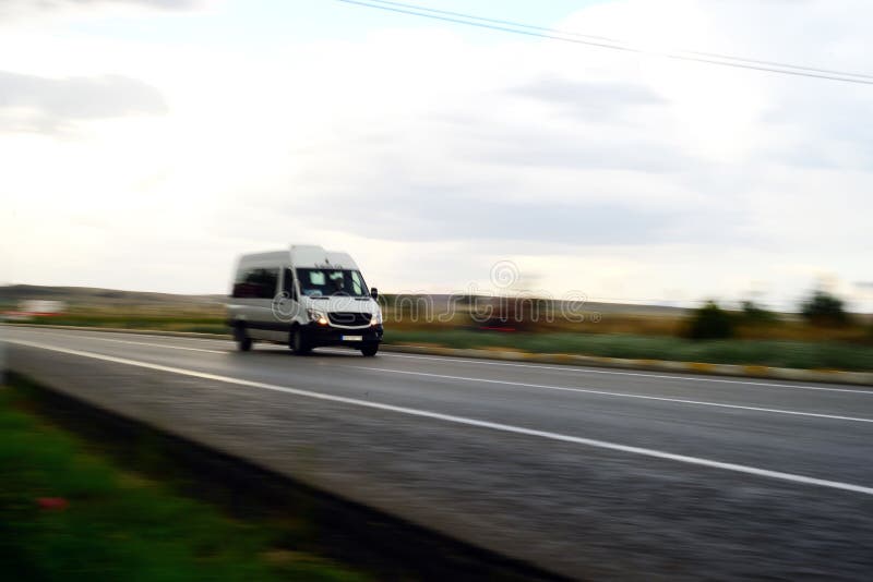 Small Cargo Minibus Passing by with a Panning Speed Effect on the Road ...