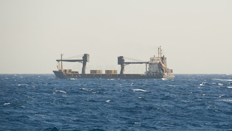 Small cargo ship at sea stock photo. Image of marine - 24701848
