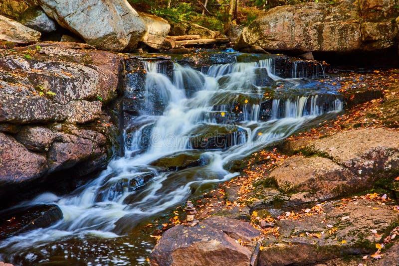 Small Cascading River with Rocks Covered in Fall Leaves and Tiny Rock ...