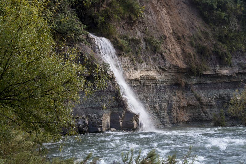 Small Cascading Waterfall Flowing into River Stock Photo - Image of ...