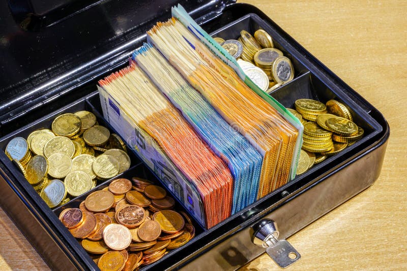 A Small Cash Box Full of Coins and Many Banknotes Stock Photo - Image ...