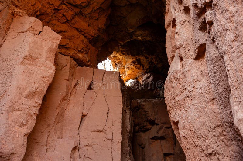 A Small Cave with a View Out from Inside it, with Holes in the Rocks ...