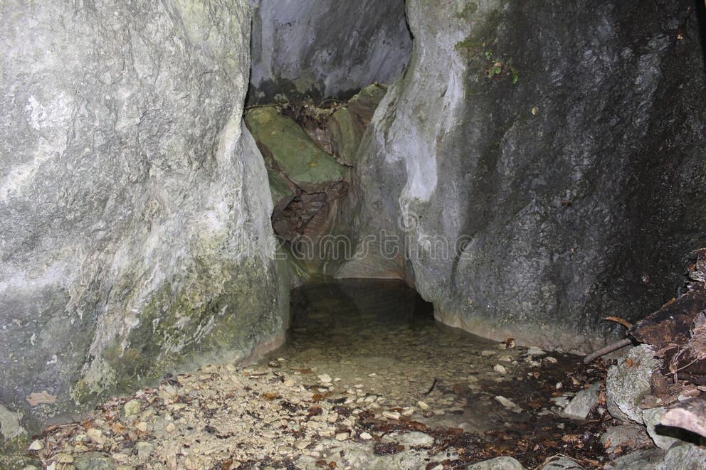 A small cave in the rocks stock photo. Image of caving - 171908474