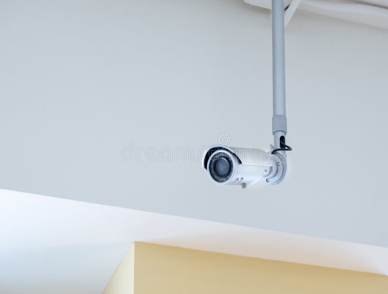 Small CCTV Camera Security Mounted on the Ceiling Stock Photo - Image ...