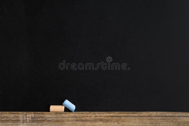 Small Chalk Pieces in Different Colors on a Blackboard Stock Image ...