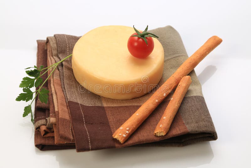 Small Cheese Wheel Next To Cherry Tomatoes Stock Photo - Image of ...