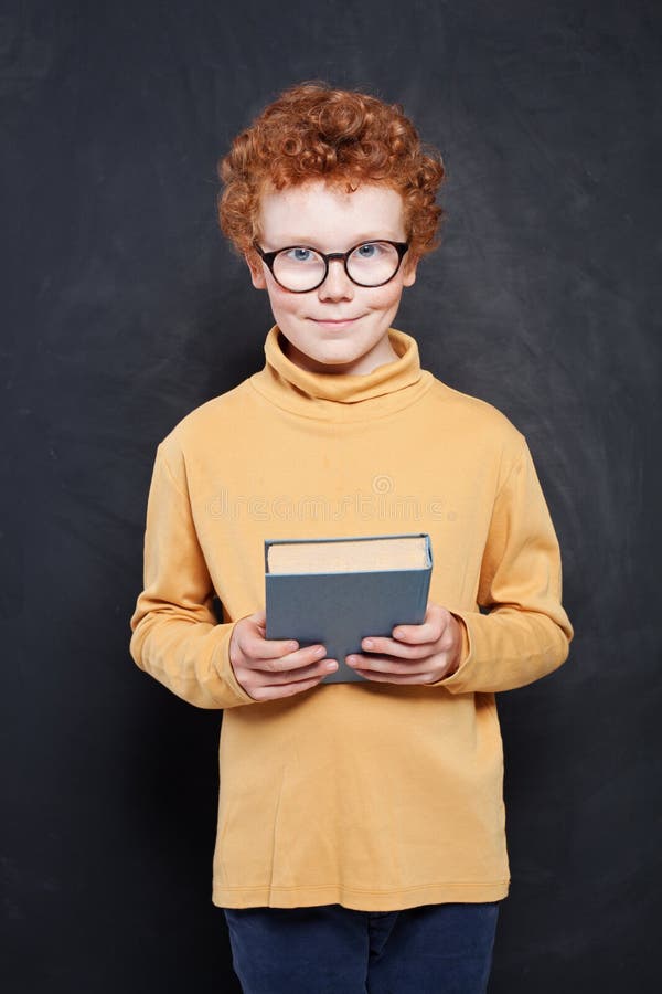 Small Child Boy Holding a Book Stock Image - Image of elementary, hair ...