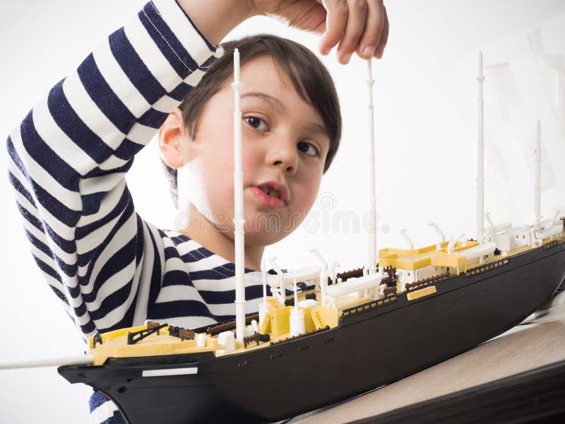 A Small Child Builds a Model Ship Stock Photo - Image of efforts ...
