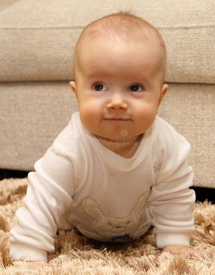 Small child on carpet stock image. Image of clambering - 12437375