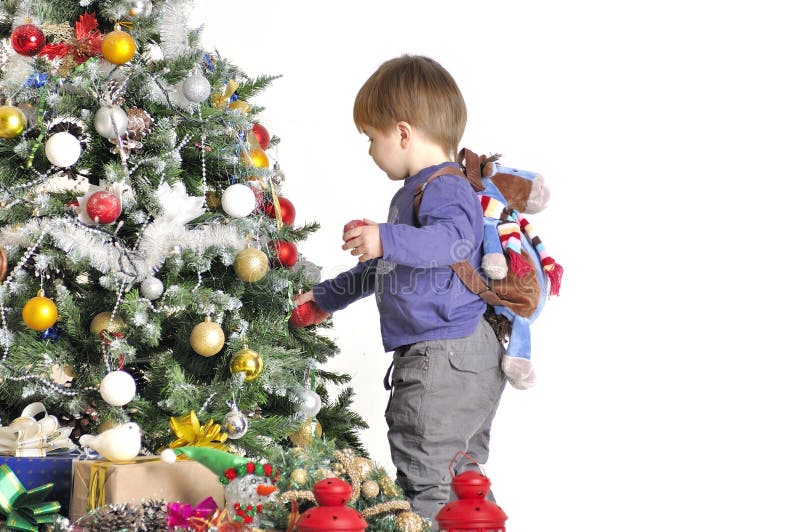Small Child about a Christmas Tree with Two Red Lamps with Backpack ...