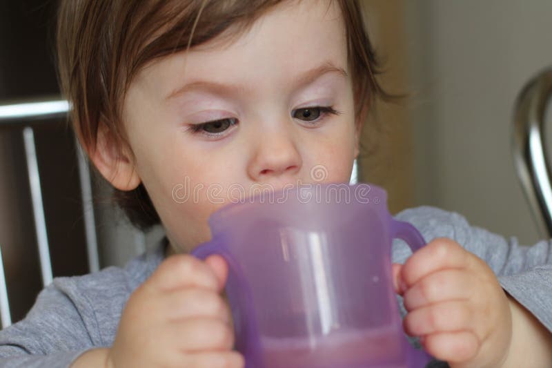 A Small Child Drinks from a Two-handed Cup. Learning To Drink from a ...