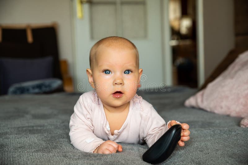 Small Child, First Steps on the Internet, a Newborn Baby is Holding a ...
