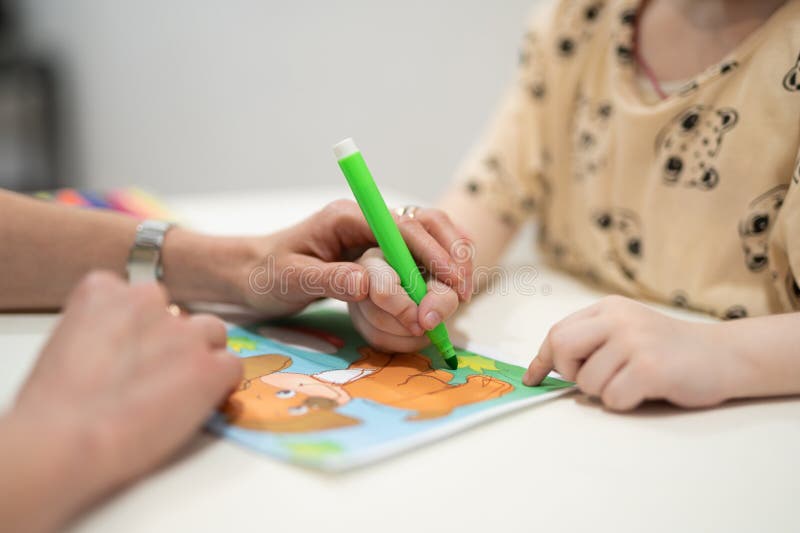 A Small Child is Learning To Draw a Picture Stock Photo - Image of ...