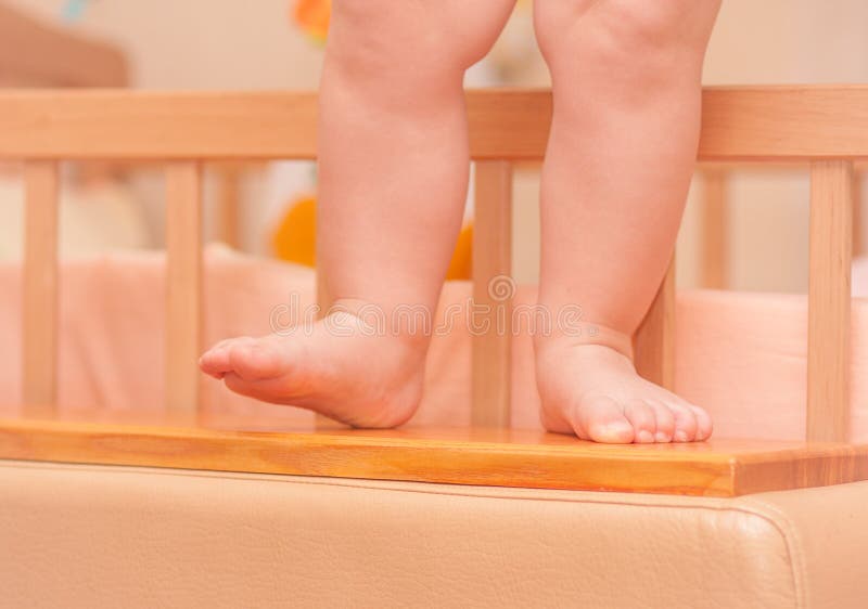 Small Child Legs Near the Cot Stock Photo - Image of foot, crib: 70019708