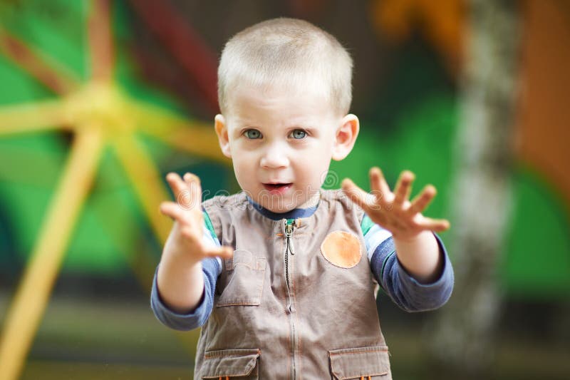 Small Child Looks into the Camera Stock Image - Image of palms, small ...