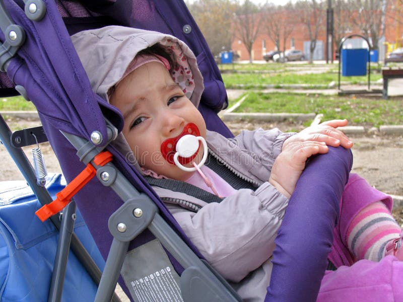 Small Child with Pacifier Sitting in Wheelchair Stock Image - Image of ...
