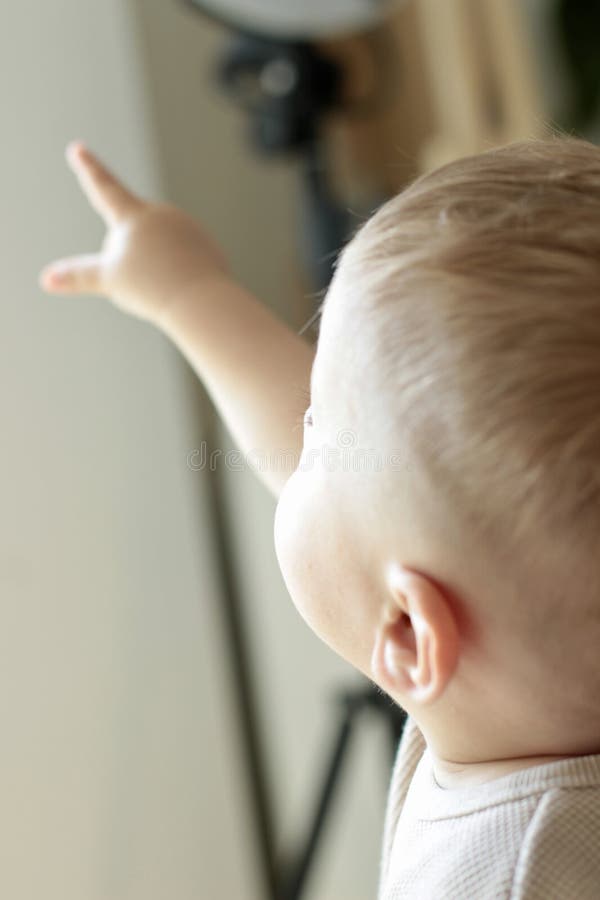 A Small Child Points a Finger Up Stock Photo - Image of childhood, baby ...