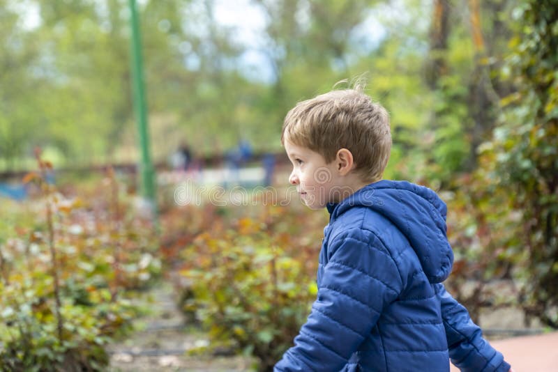 Small Child Running in a Park Stock Photo - Image of caucasian, blue ...