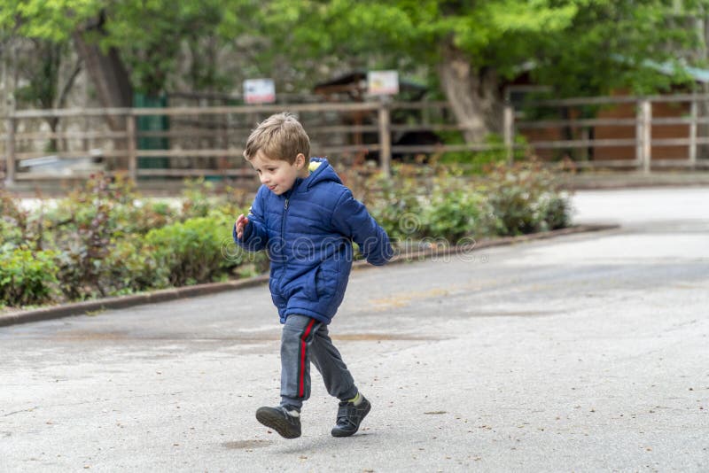 Small Child Running in a Park Stock Photo - Image of cute, outdoor ...