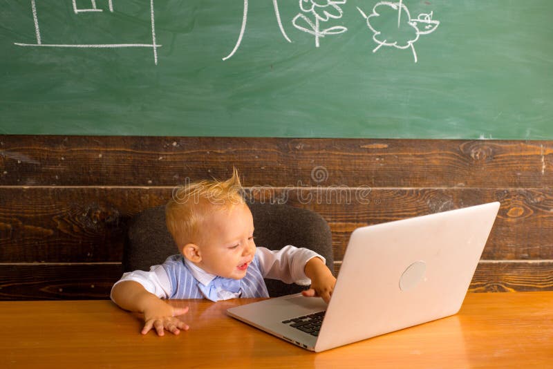 Small Child Work on Education Computer Laptop in School Classroom ...