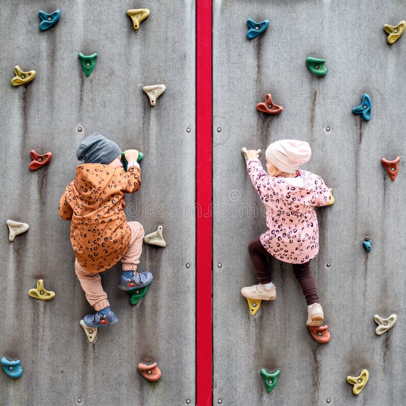 Small Children Climbing a Rock Wall at Playground Stock Image - Image ...