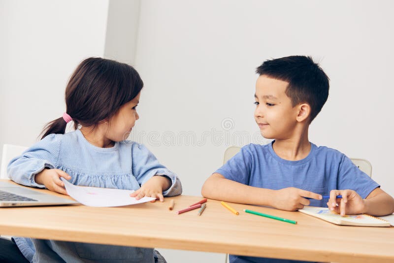 Small Children Sit at the Table during Class and Look at Each Other ...