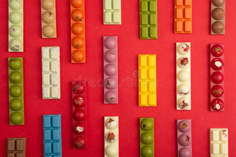 Small Chocolate Candies Pattern on Red. a Delicious Mix of Colorful ...